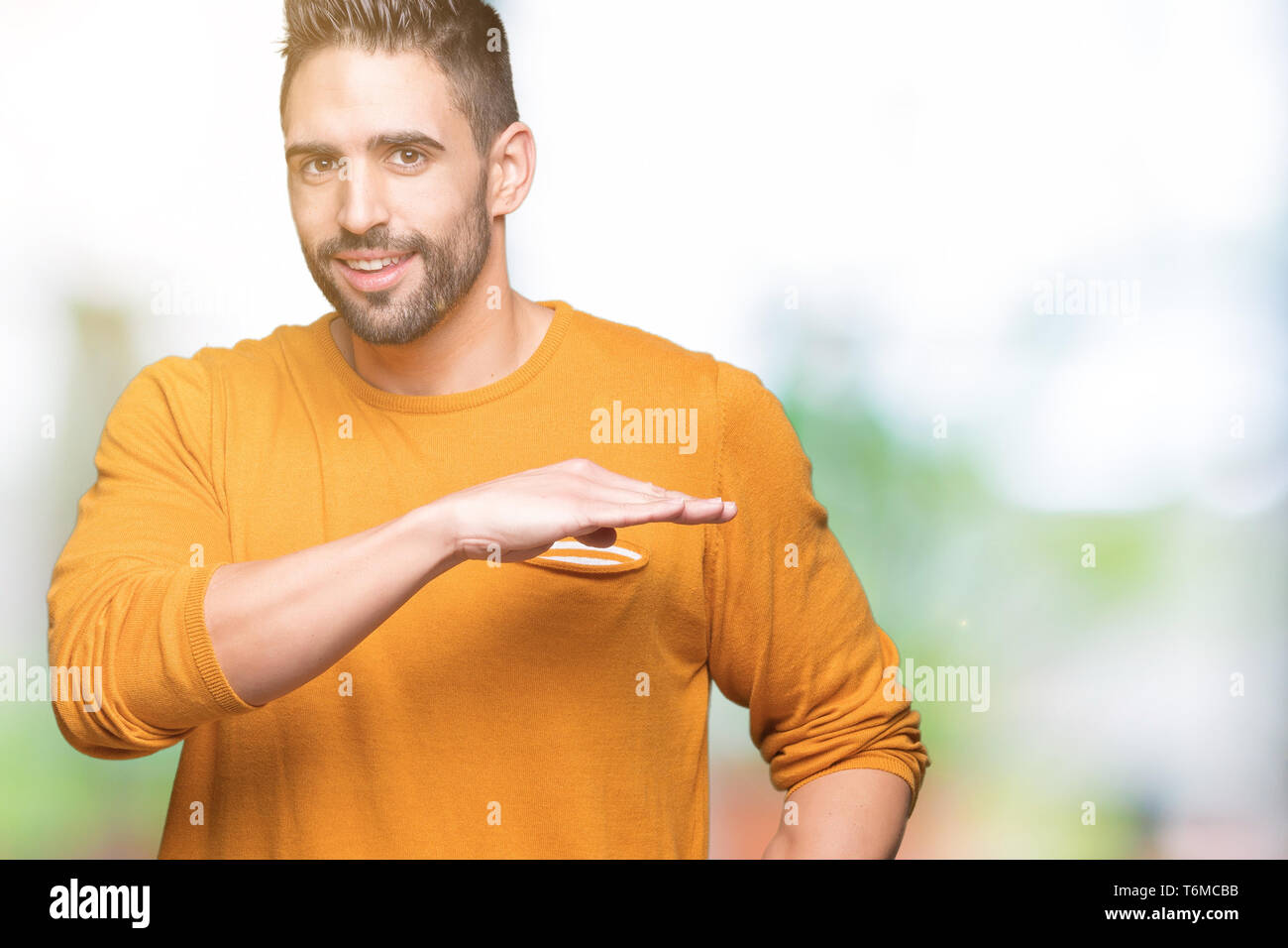 Young handsome man over isolated background gesturing with hands ...