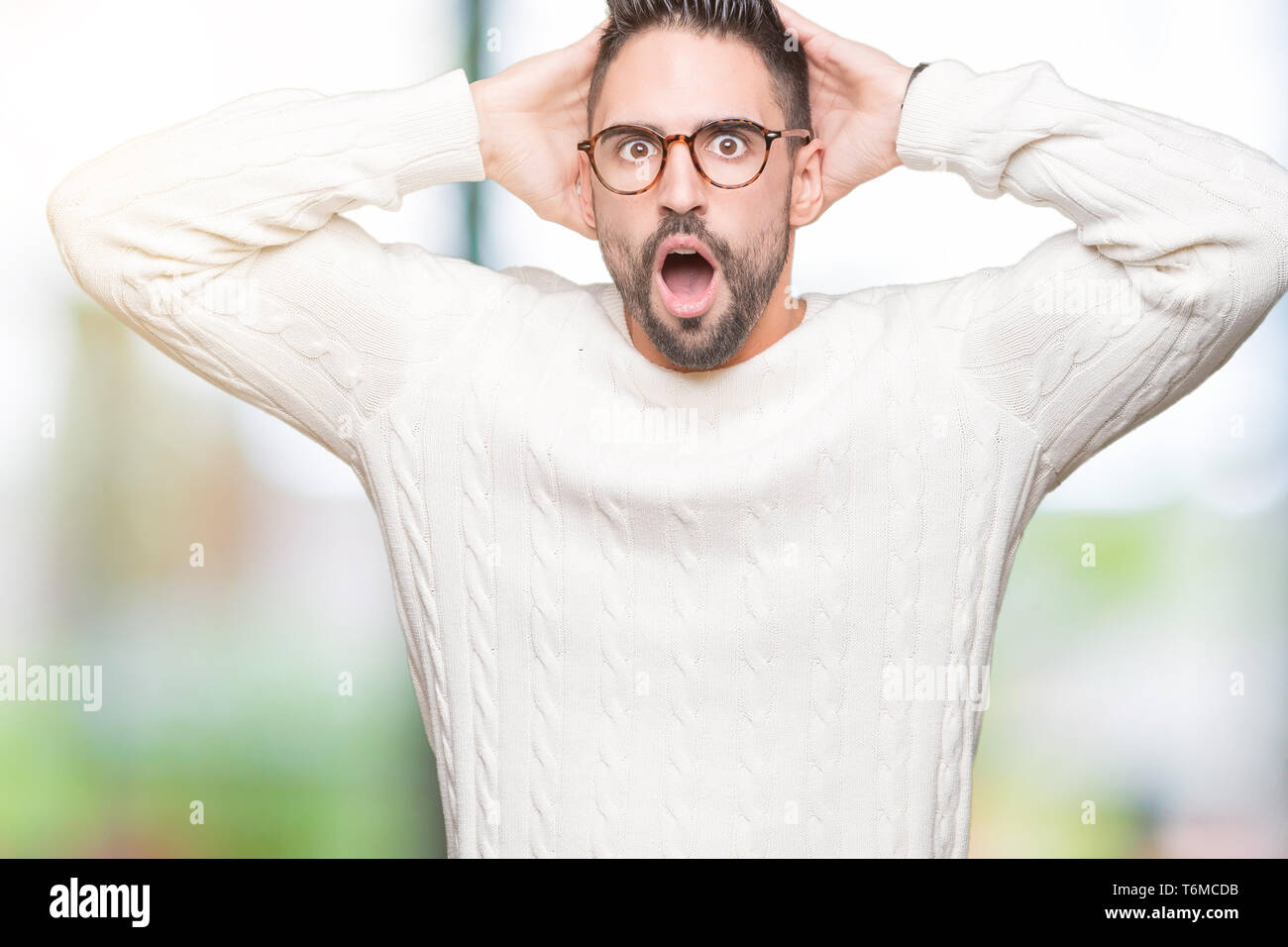 Young handsome man wearing glasses over isolated background Crazy and ...