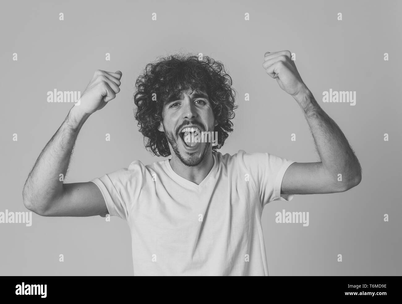 Young man winner joy Black and White Stock Photos & Images - Alamy