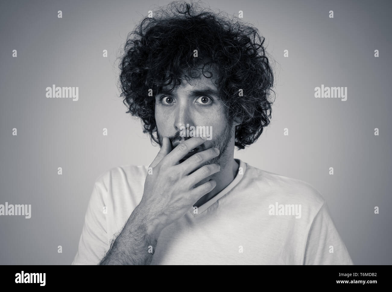 Portrait of funny attractive young man with happy and surprised face ...