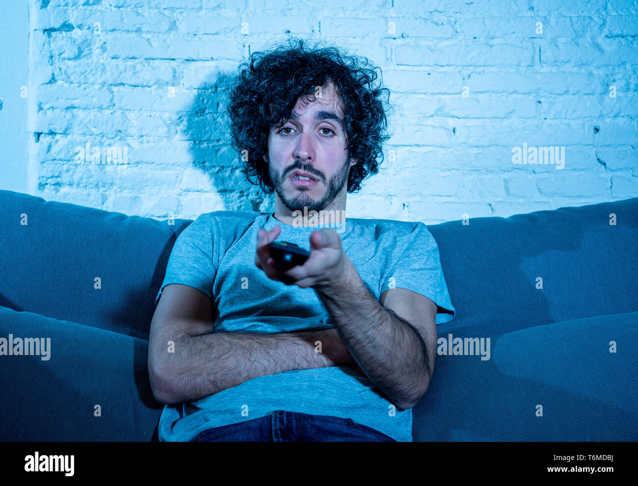 Man watching tv alone in dark hi-res stock photography and images - Alamy