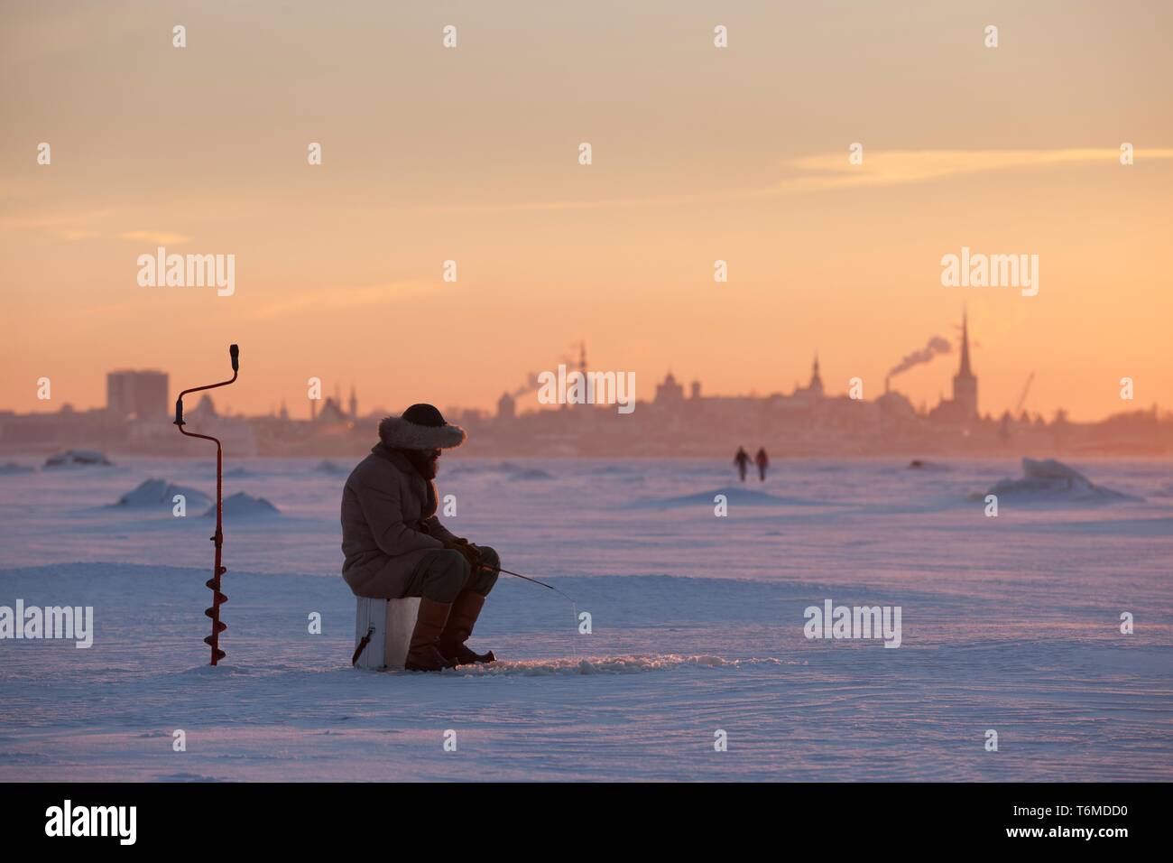 Ice fishing man sunrise hi-res stock photography and images - Alamy