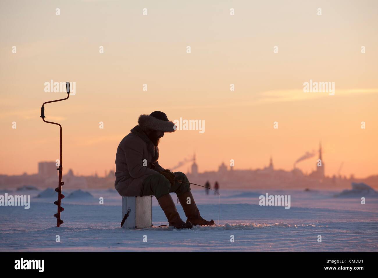 Ice fishing man sunrise hi-res stock photography and images - Alamy