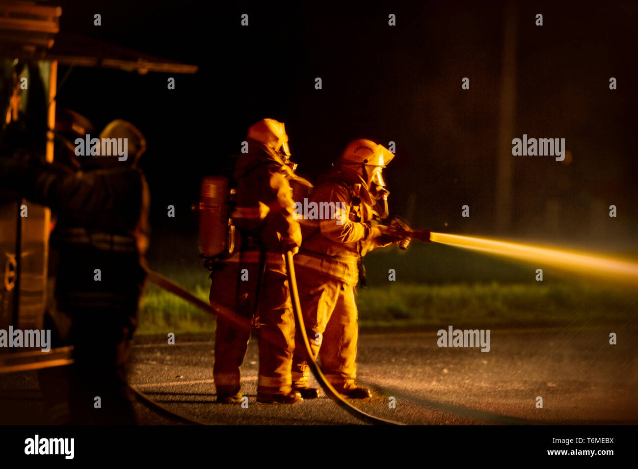 Three fire hoses hi-res stock photography and images - Alamy