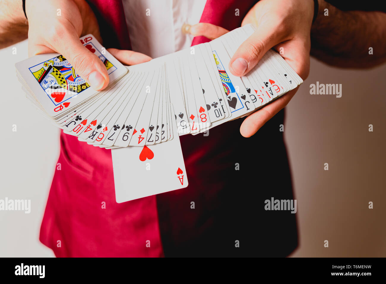 Hands of magician doing tricks with a deck of cards Stock Photo - Alamy