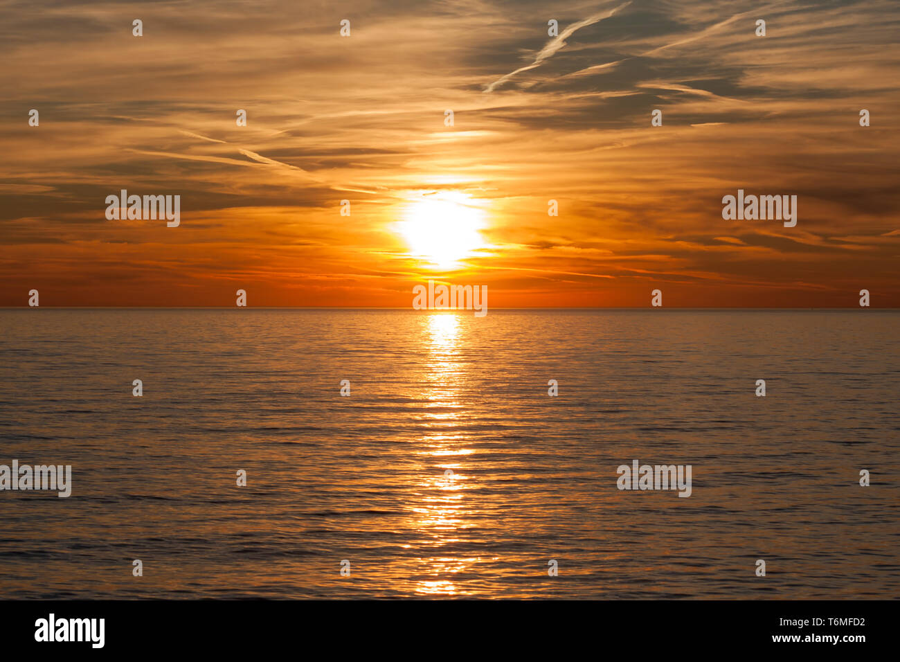 Cloudscape sunset reflection over sea hi-res stock photography and ...