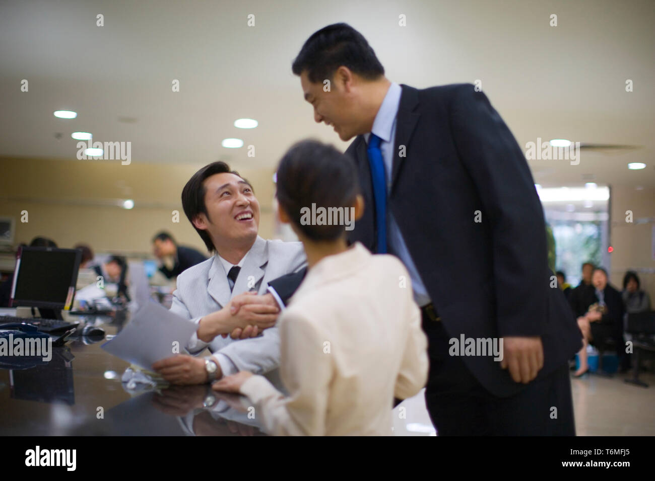 Man being congratulated hi-res stock photography and images - Alamy
