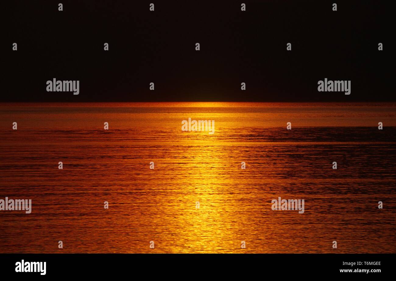 Golden Reflection on the Sea Surface Stock Photo - Alamy