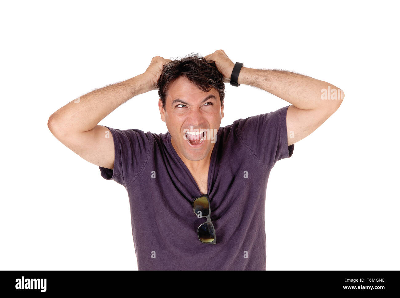 Screaming young man in a closeup image Stock Photo - Alamy