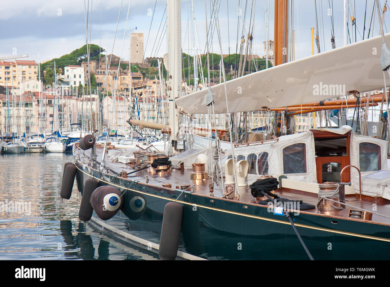 Cannes harbor with fortress and sailing ships, France Stock Photo - Alamy