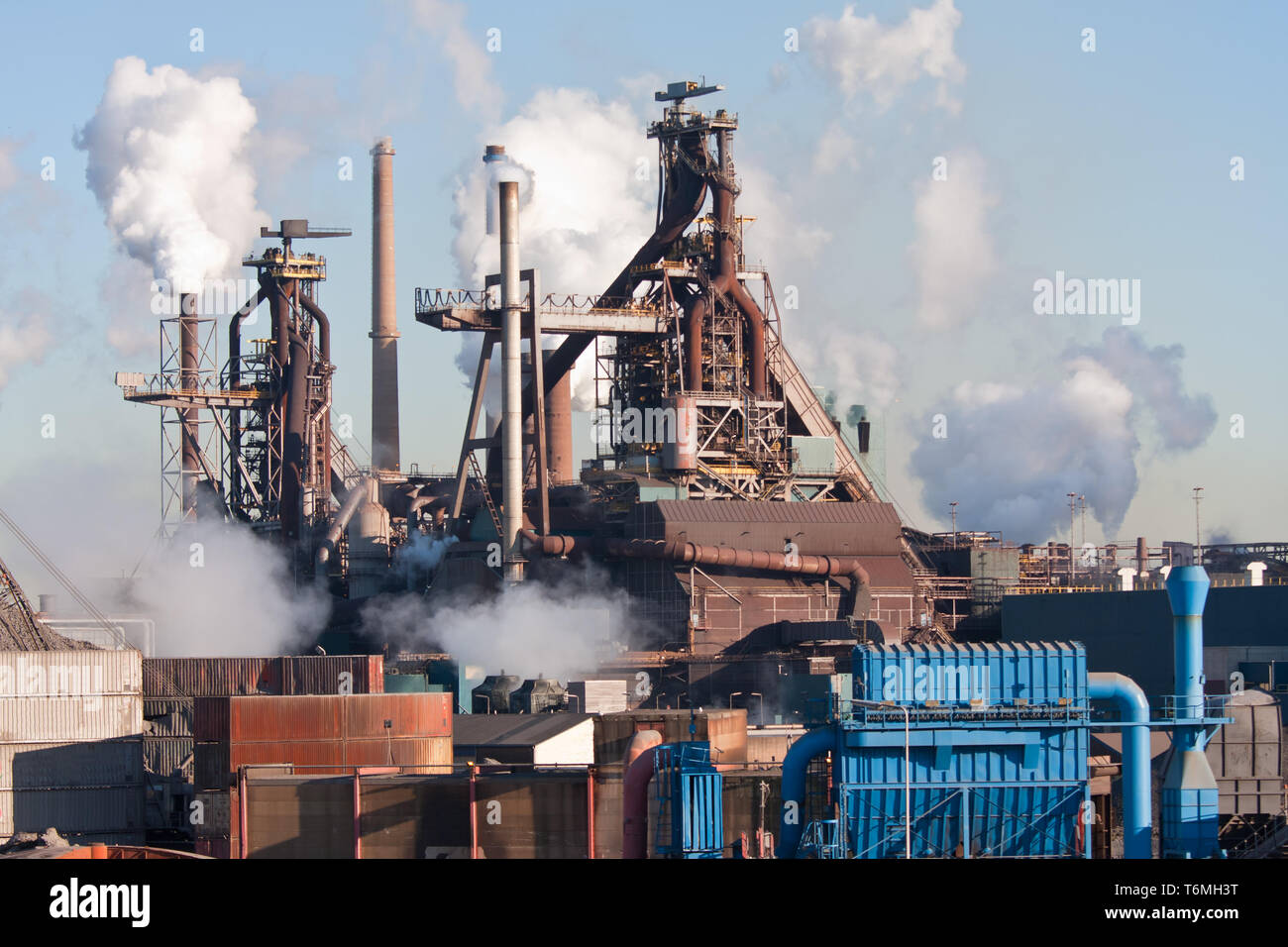 Steel factory with smokestacks Stock Photo - Alamy