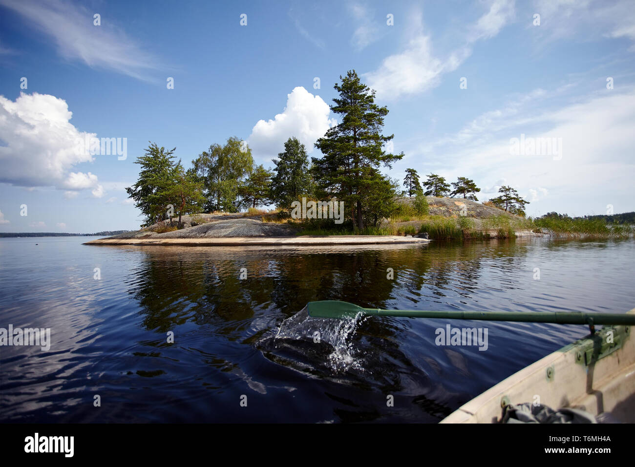 Island in the lake. Water landscape with stones. Stones in water. The ...