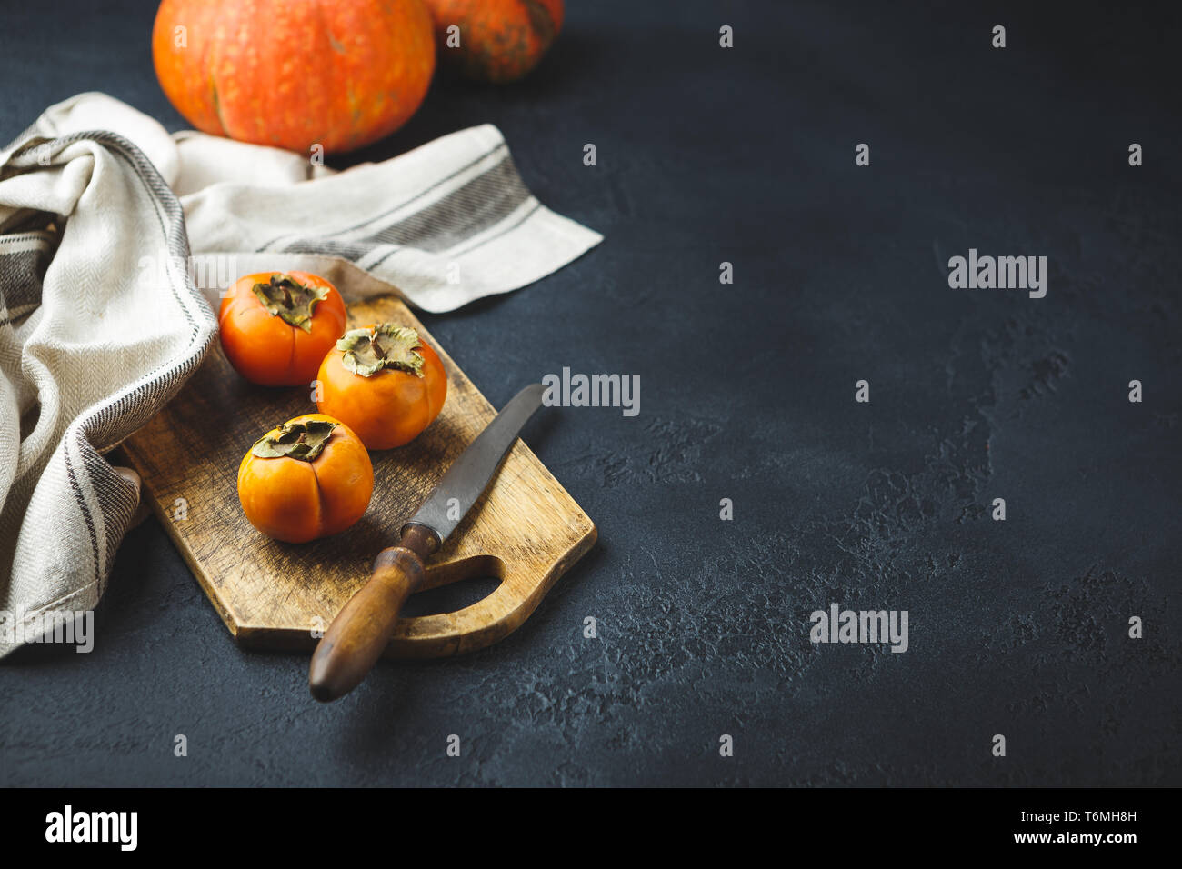 Persimmon, pumpkin, corn Stock Photo - Alamy