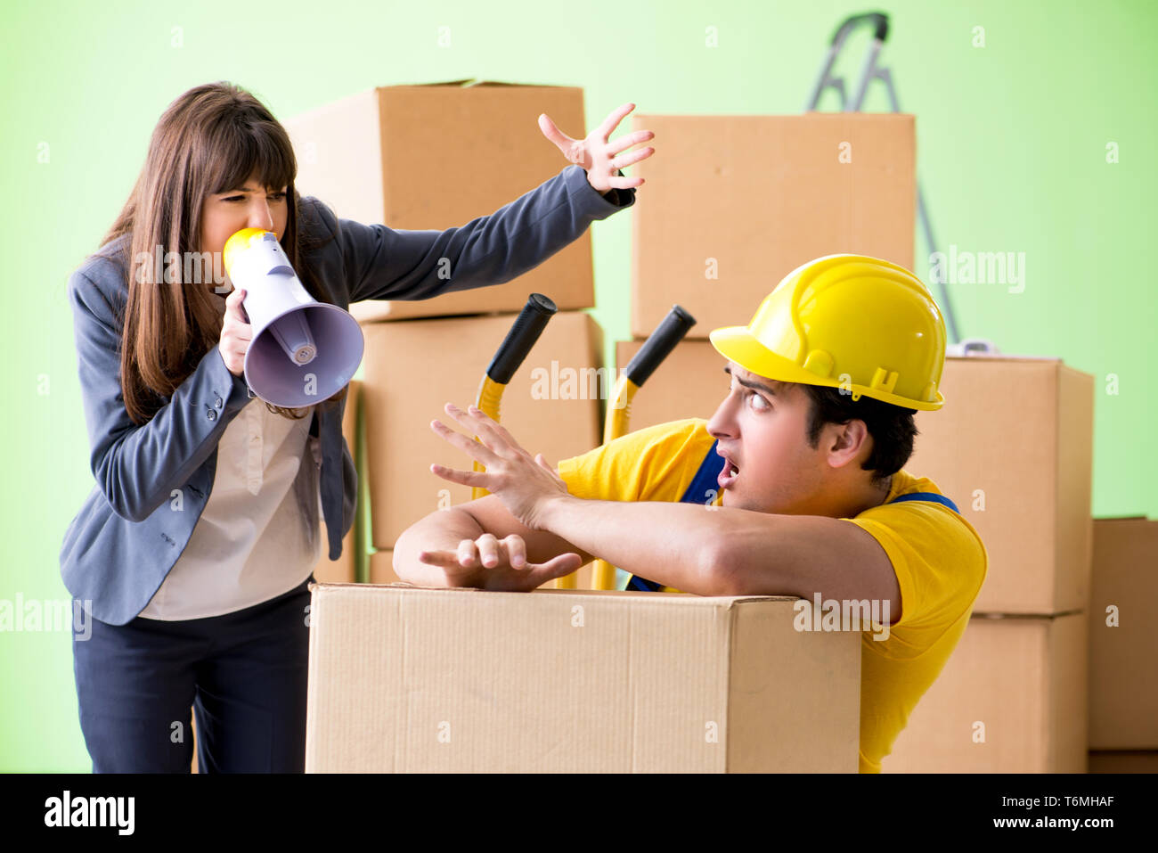 Woman boss and man contractor working with boxes delivery Stock Photo ...