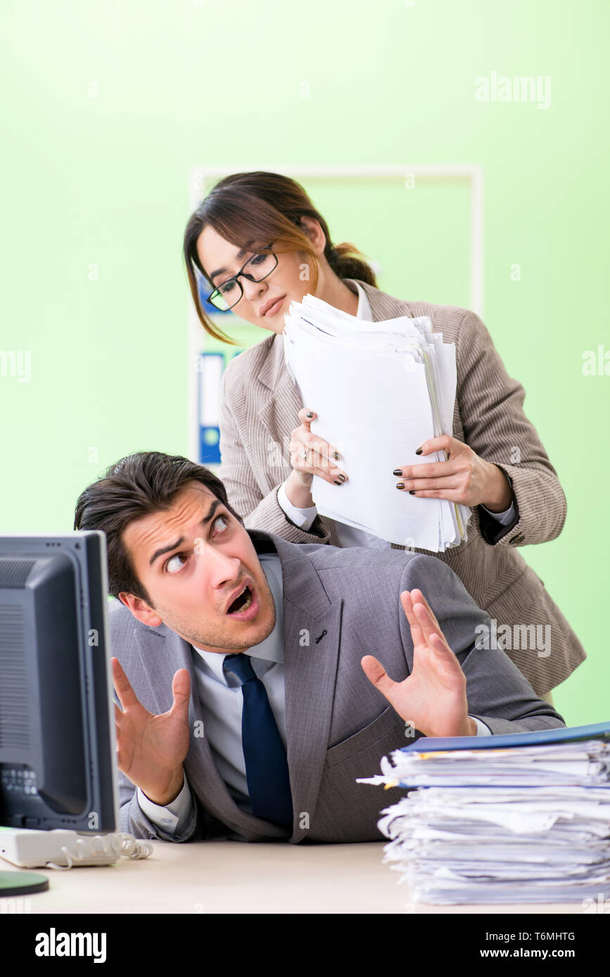Man employee suffering from excessive work Stock Photo - Alamy