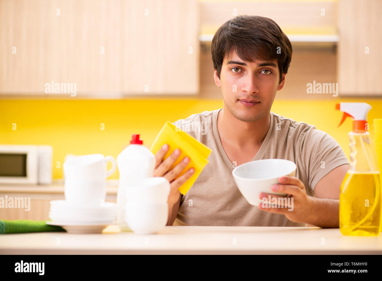 Man washing dishes at home Stock Photo - Alamy