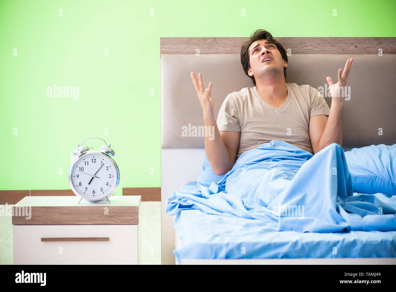 Man having trouble with his sleep Stock Photo - Alamy