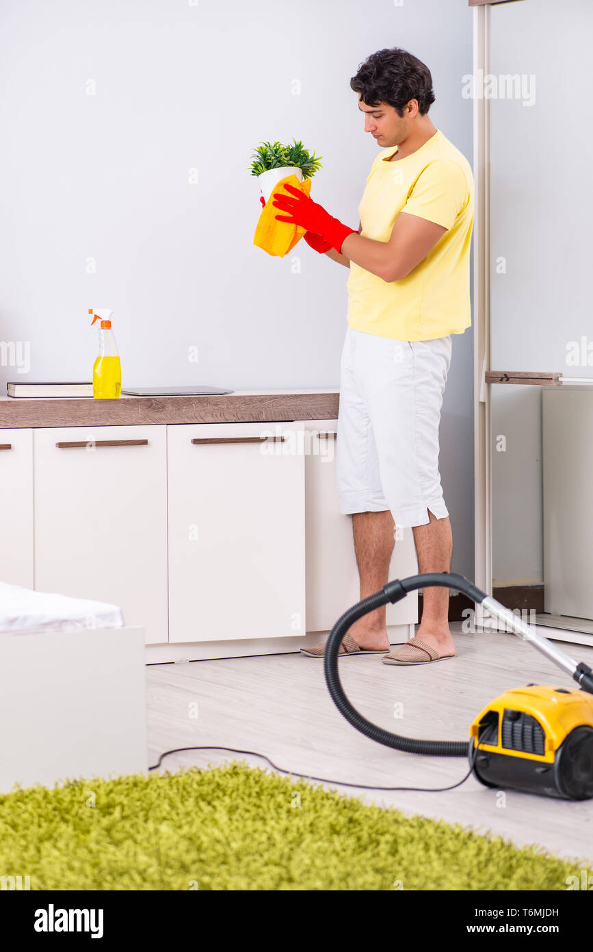 Man vacuuming bed hi-res stock photography and images - Alamy