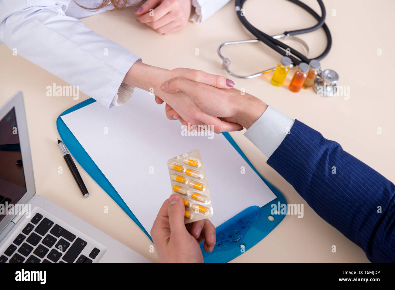 Doctor visiting shaking hands hi-res stock photography and images - Alamy