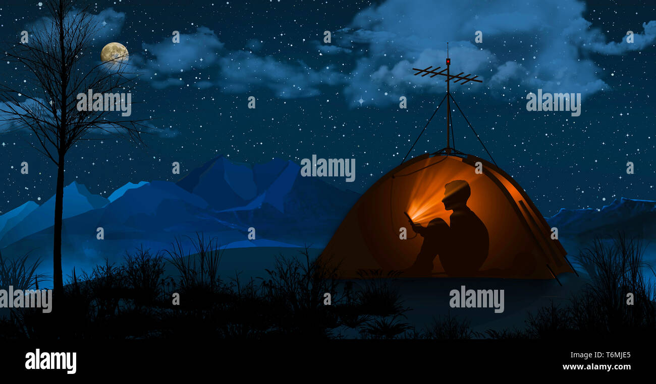 A wilderness camper sits in his tent using a cell phone. This ...