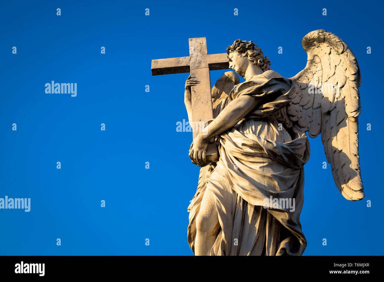 Catholic angel with cross Stock Photo - Alamy