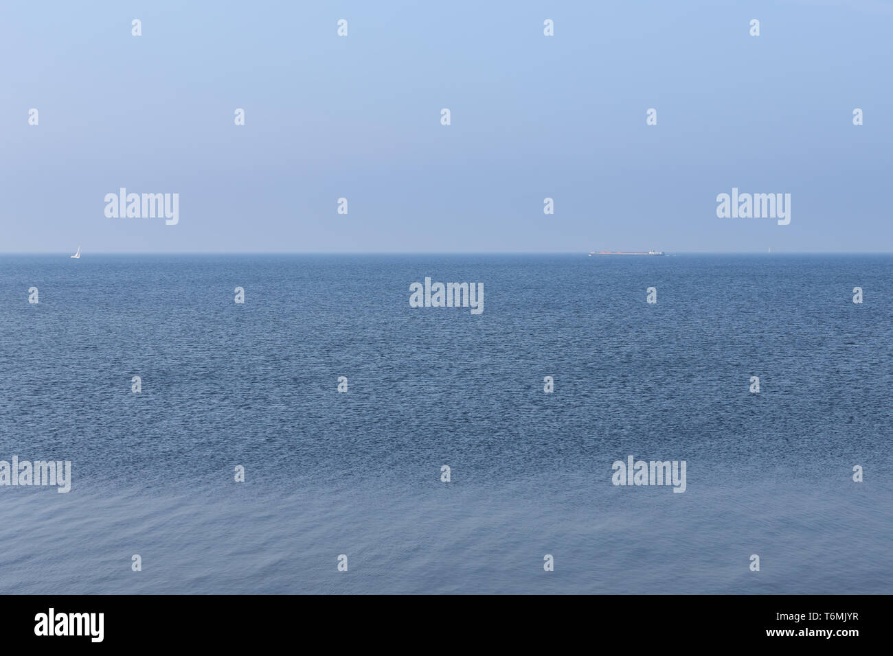 Endless Dutch sea with blue sky Stock Photo - Alamy