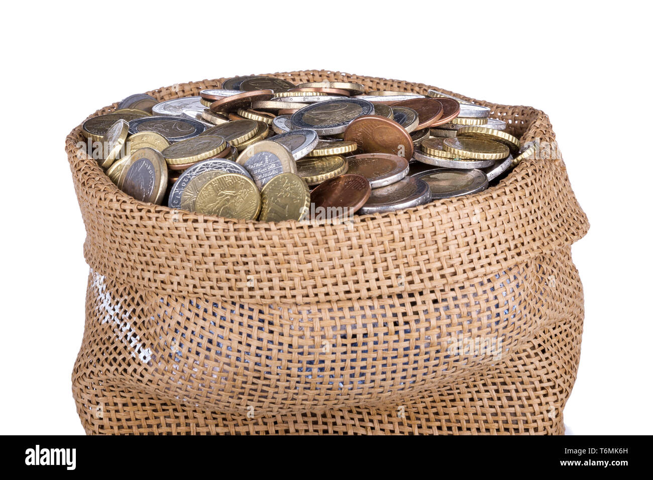 Money bag with coins isolated at a white background Stock Photo - Alamy