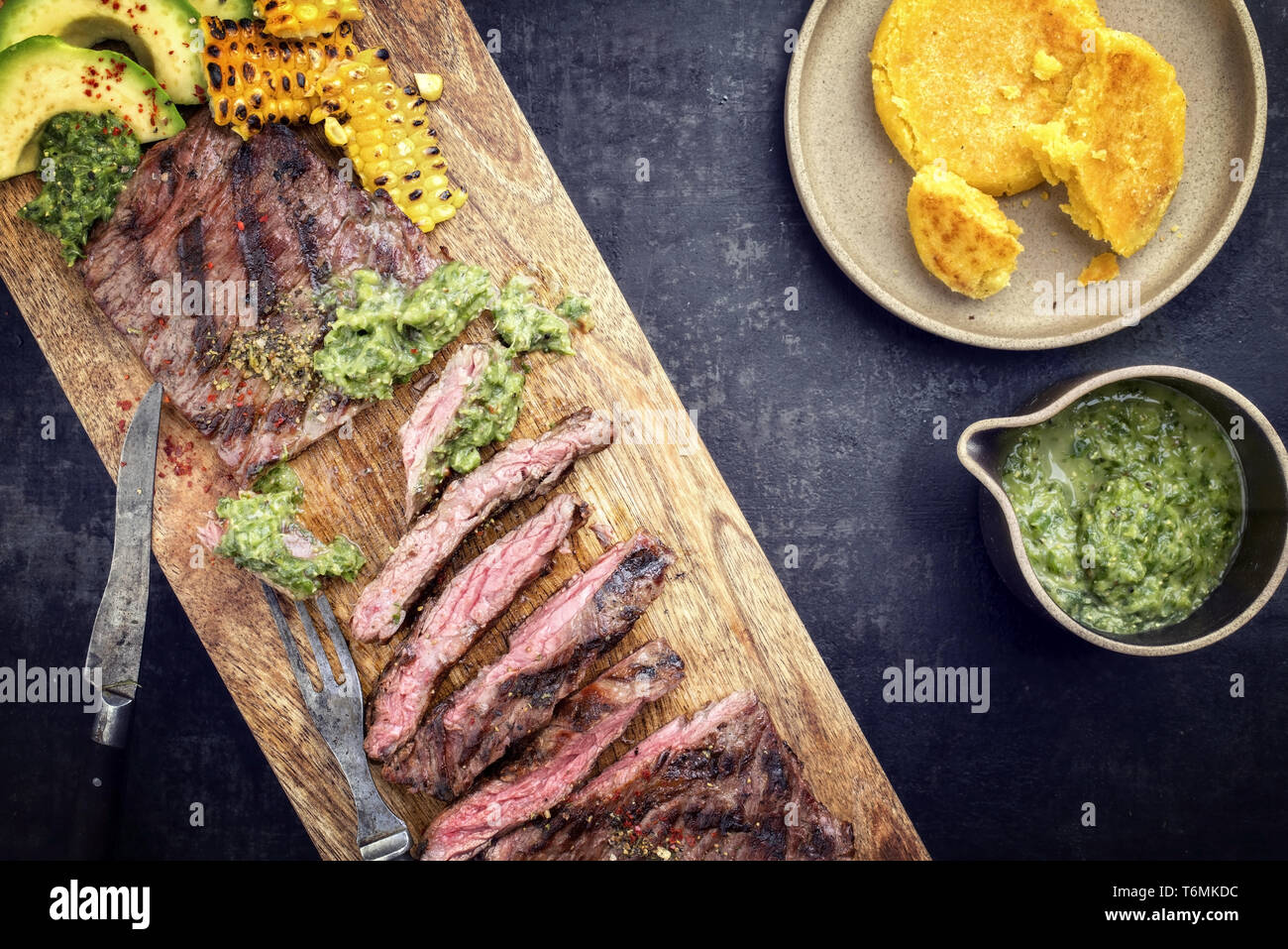 Barbecue dry aged wagyu flank steak with arepas corn Stock Photo - Alamy