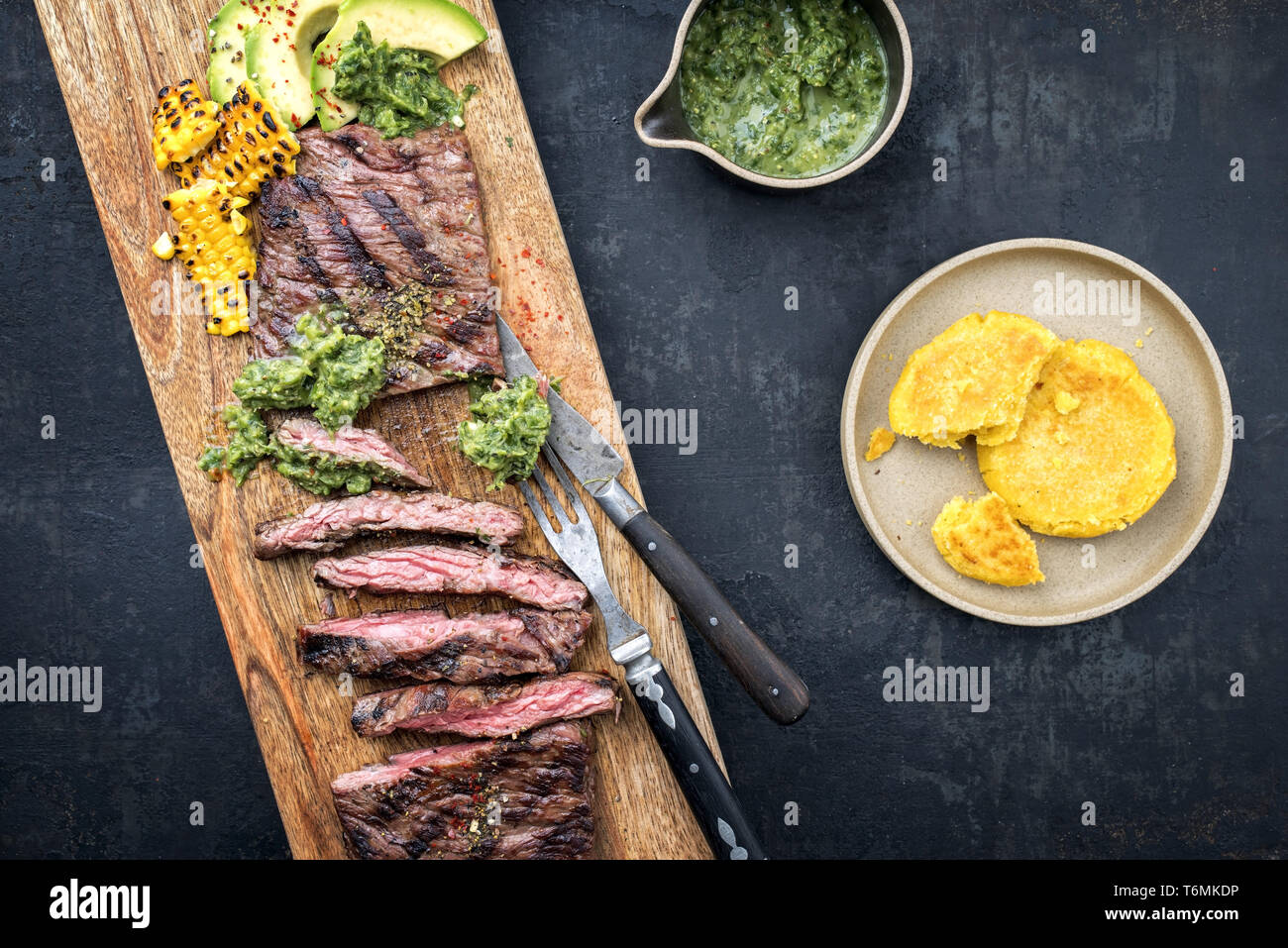 Barbecue dry aged wagyu flank steak with arepas Stock Photo - Alamy