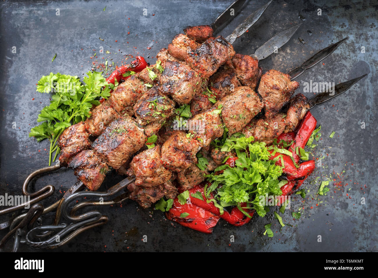 Traditional Russian shashlik on a barbecue skewer with paprika as ...