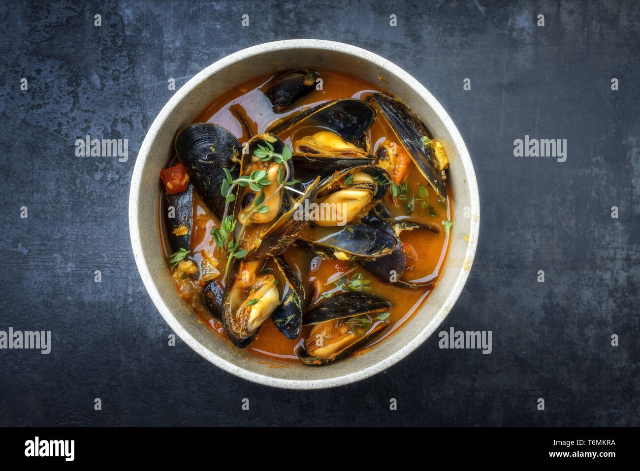 Traditional French Corsican mussel stew with mussels as top view in a ...