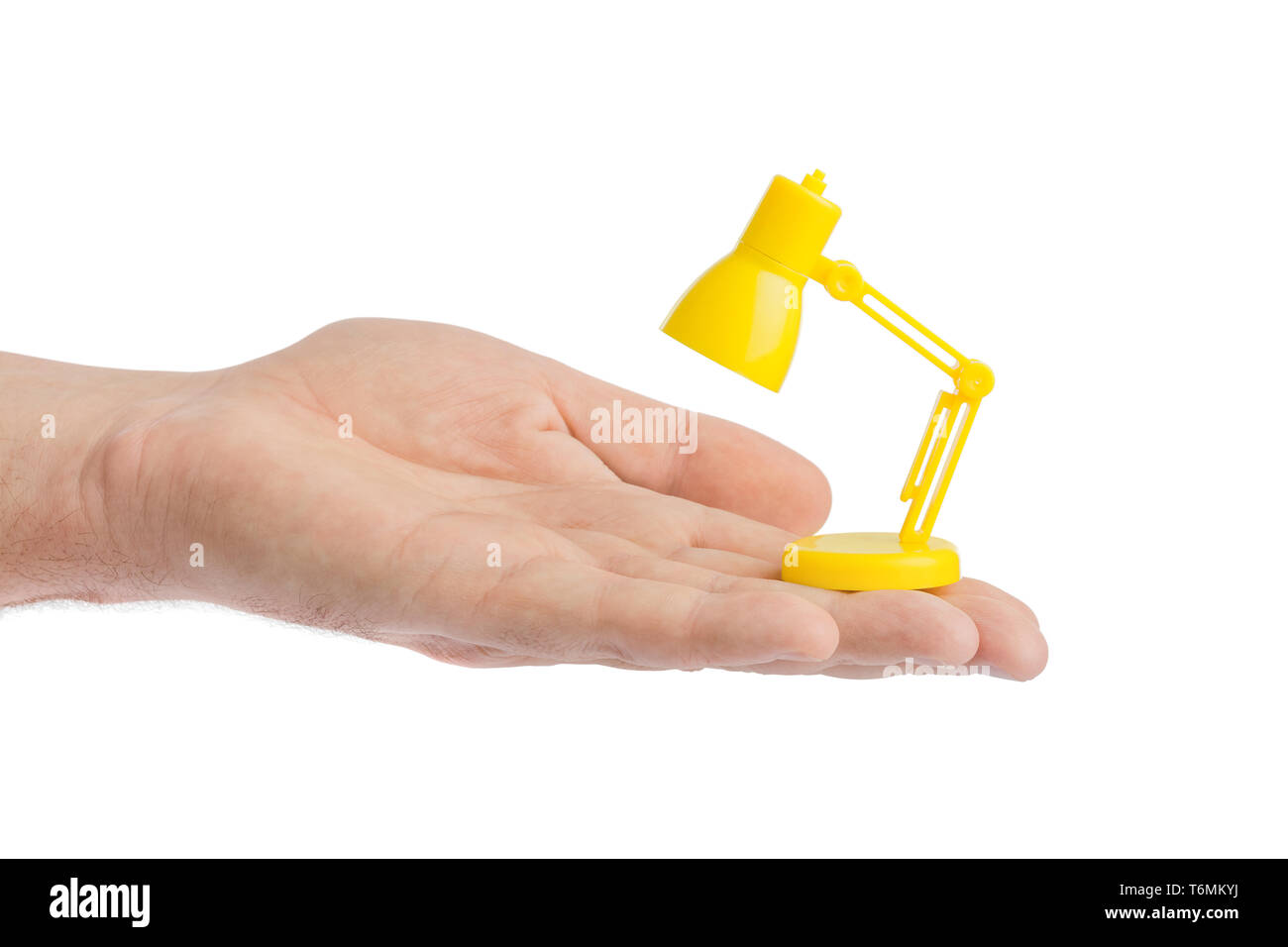 Hand with small desk lamp Stock Photo - Alamy