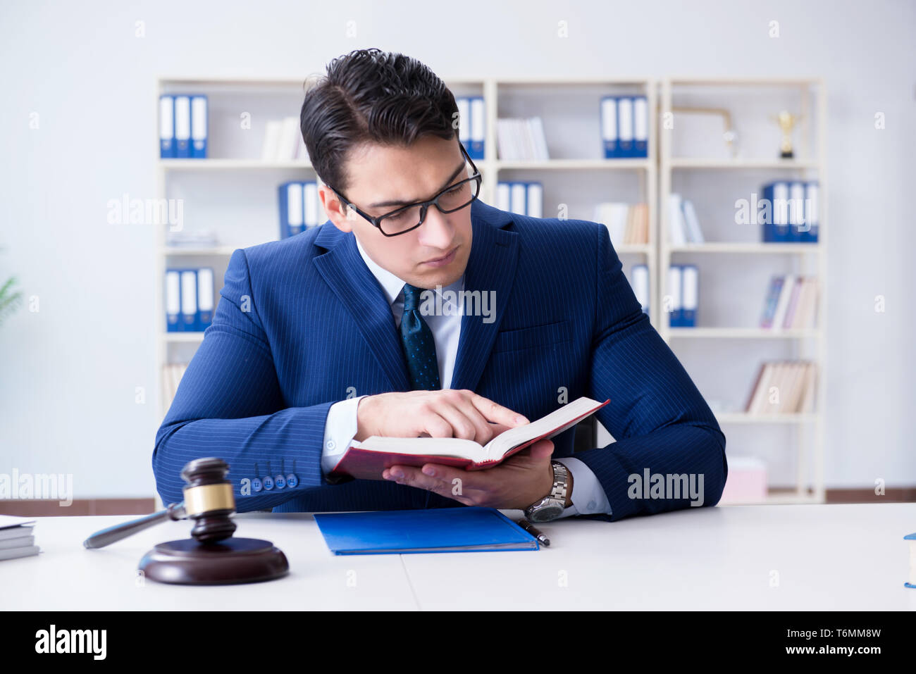 Lawyer working in his office Stock Photo - Alamy