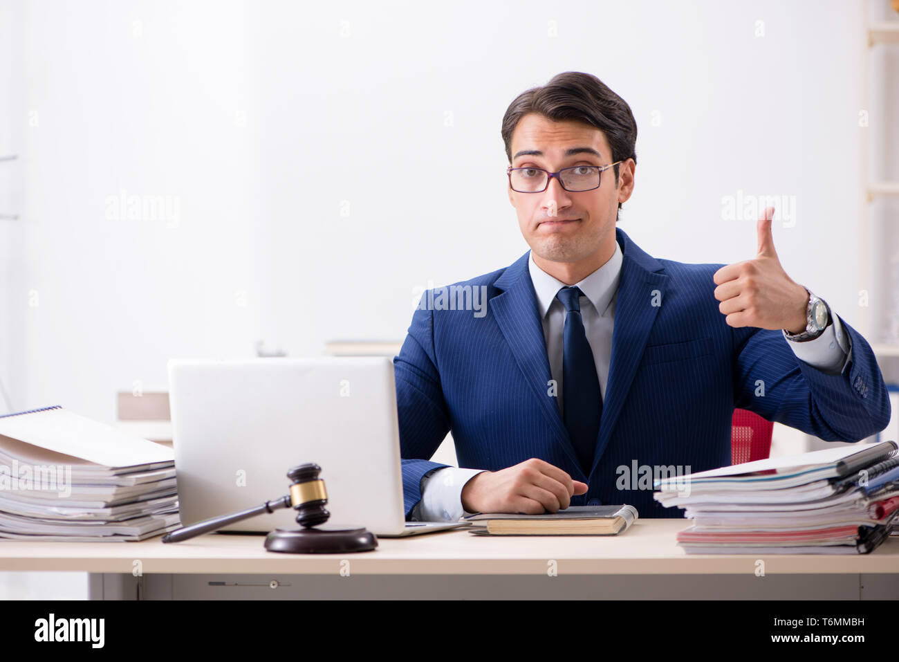 Young handsome judge working in court Stock Photo - Alamy
