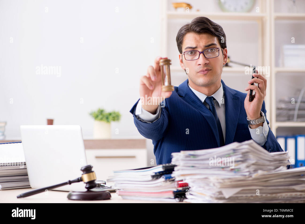 Young handsome judge working in court Stock Photo - Alamy