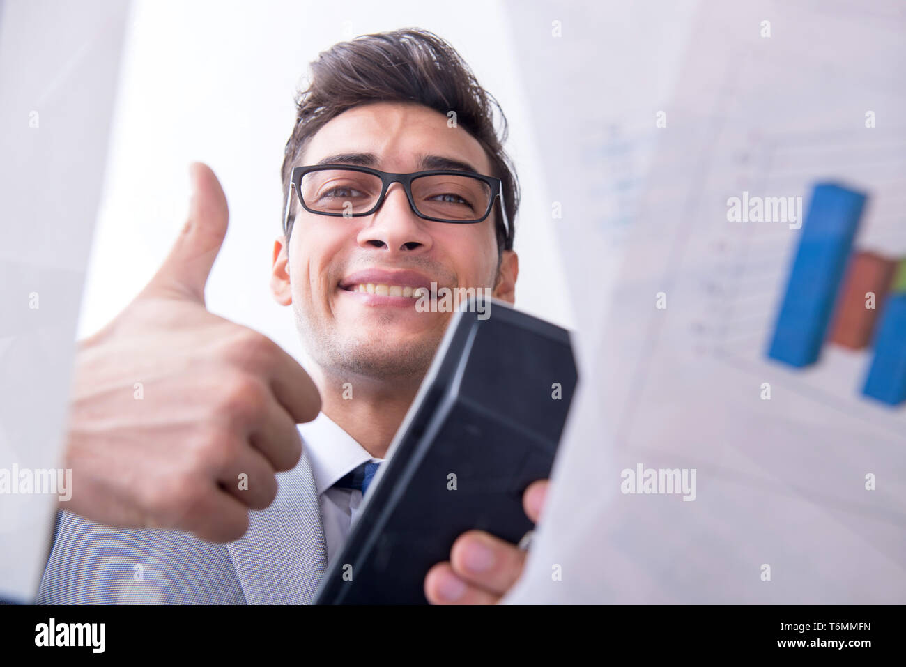 Businessman looking at financial charts and graphs Stock Photo - Alamy