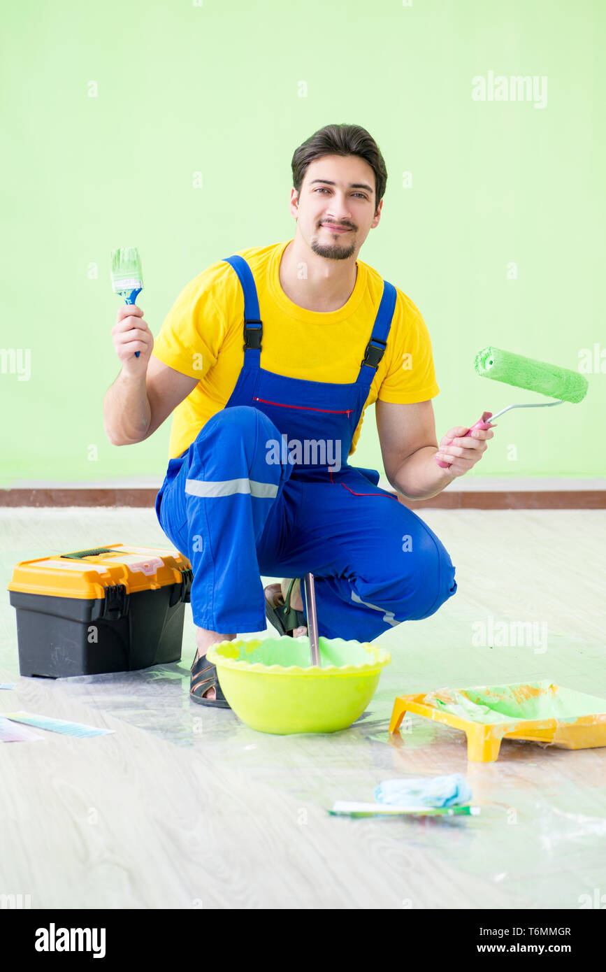 Young man doing home renovation Stock Photo - Alamy