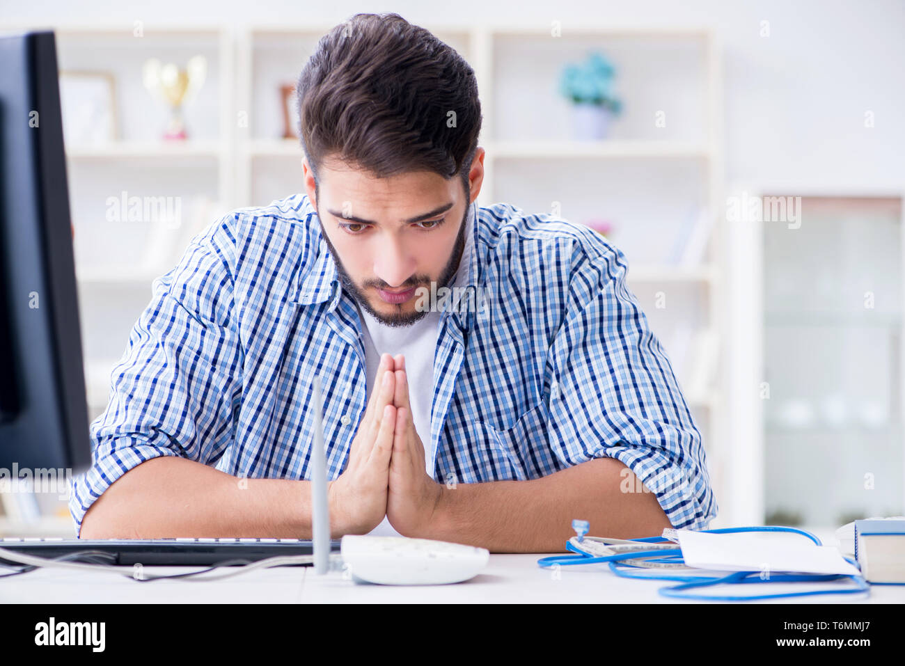 Frustrated young man due to weak internet reception Stock Photo - Alamy