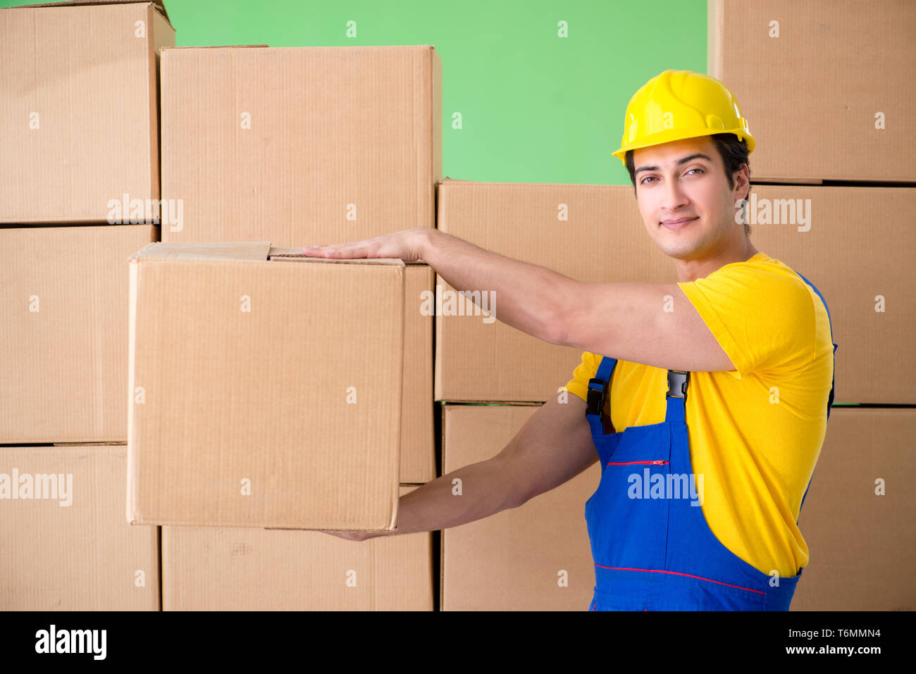Man contractor working with boxes delivery Stock Photo - Alamy