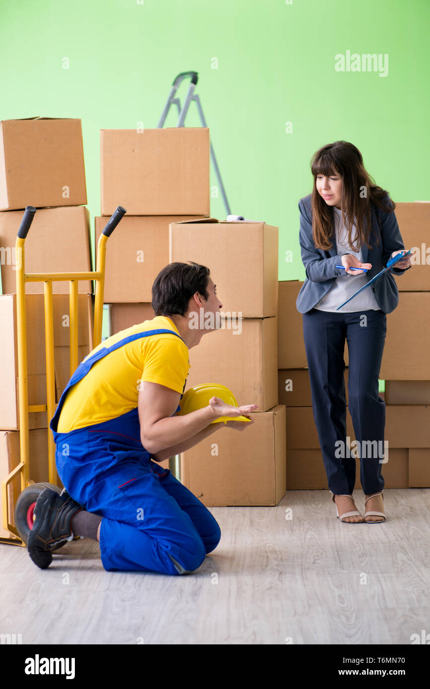 Woman boss and man contractor working with boxes delivery Stock Photo ...