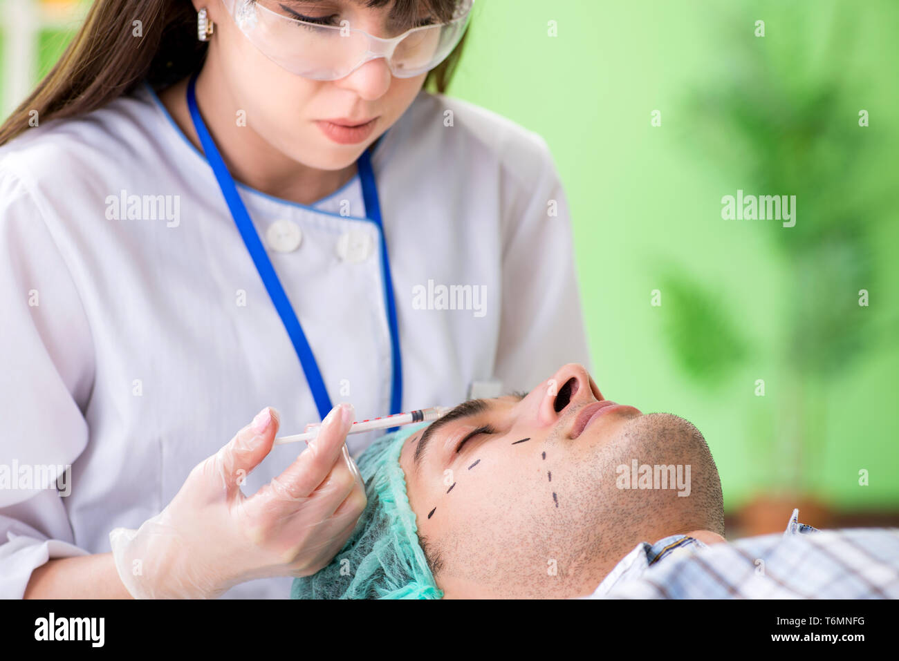 Plastic surgeon preparing for operation on man face Stock Photo - Alamy