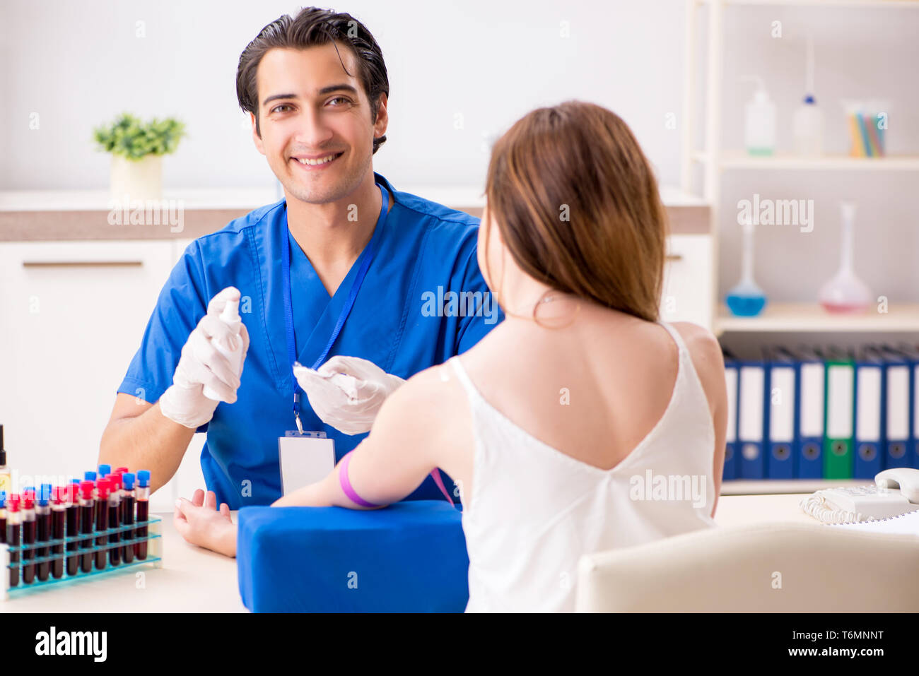 Young patient during blood test sampling procedure Stock Photo - Alamy