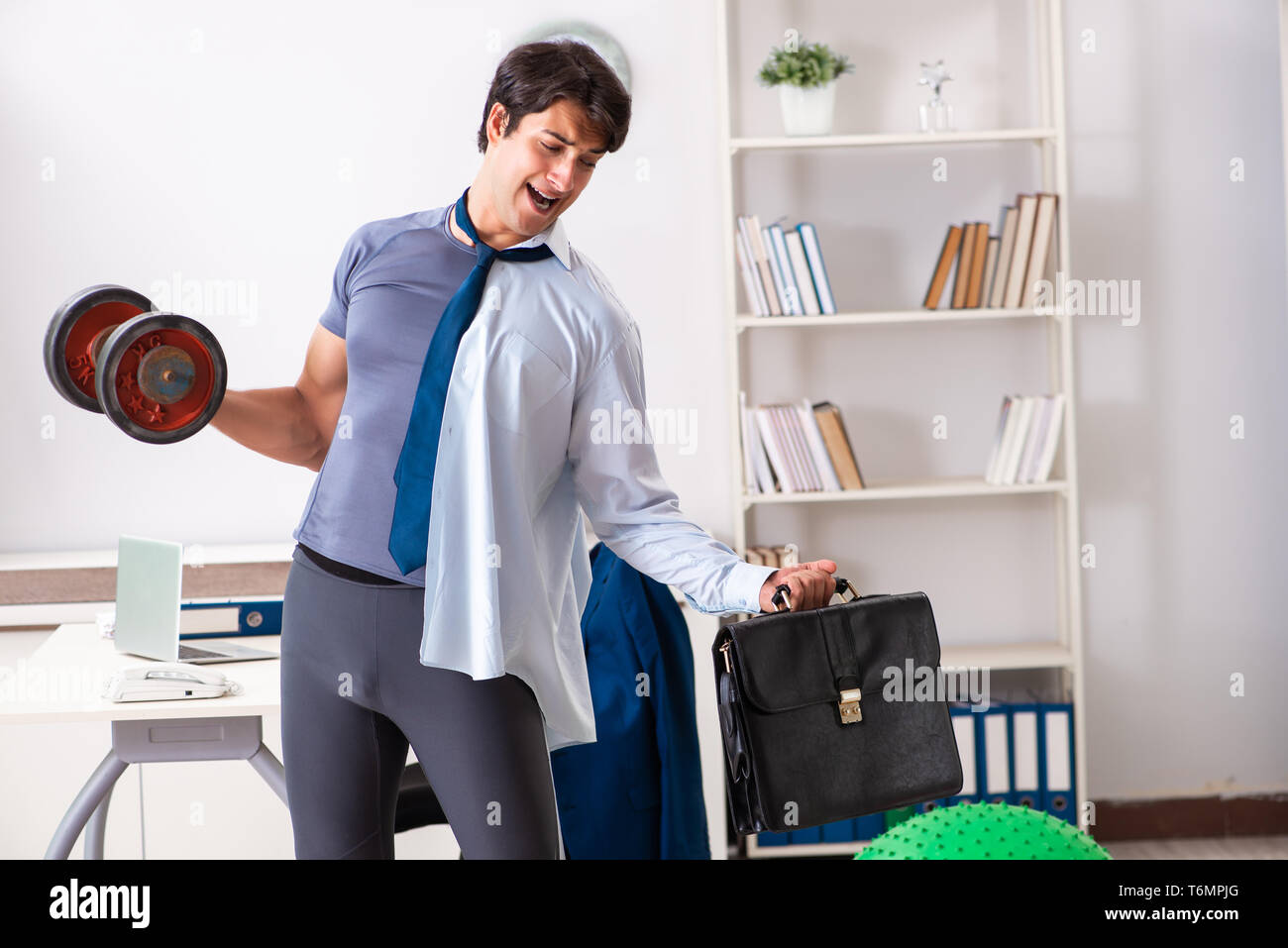 Employee combining work and healthy lifestyle Stock Photo - Alamy