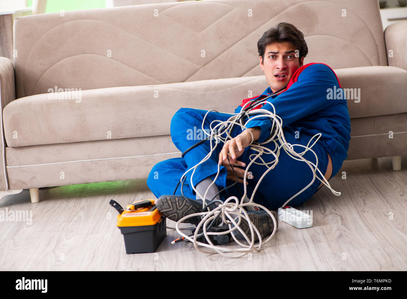 Electrician contractor with tangled cables Stock Photo - Alamy
