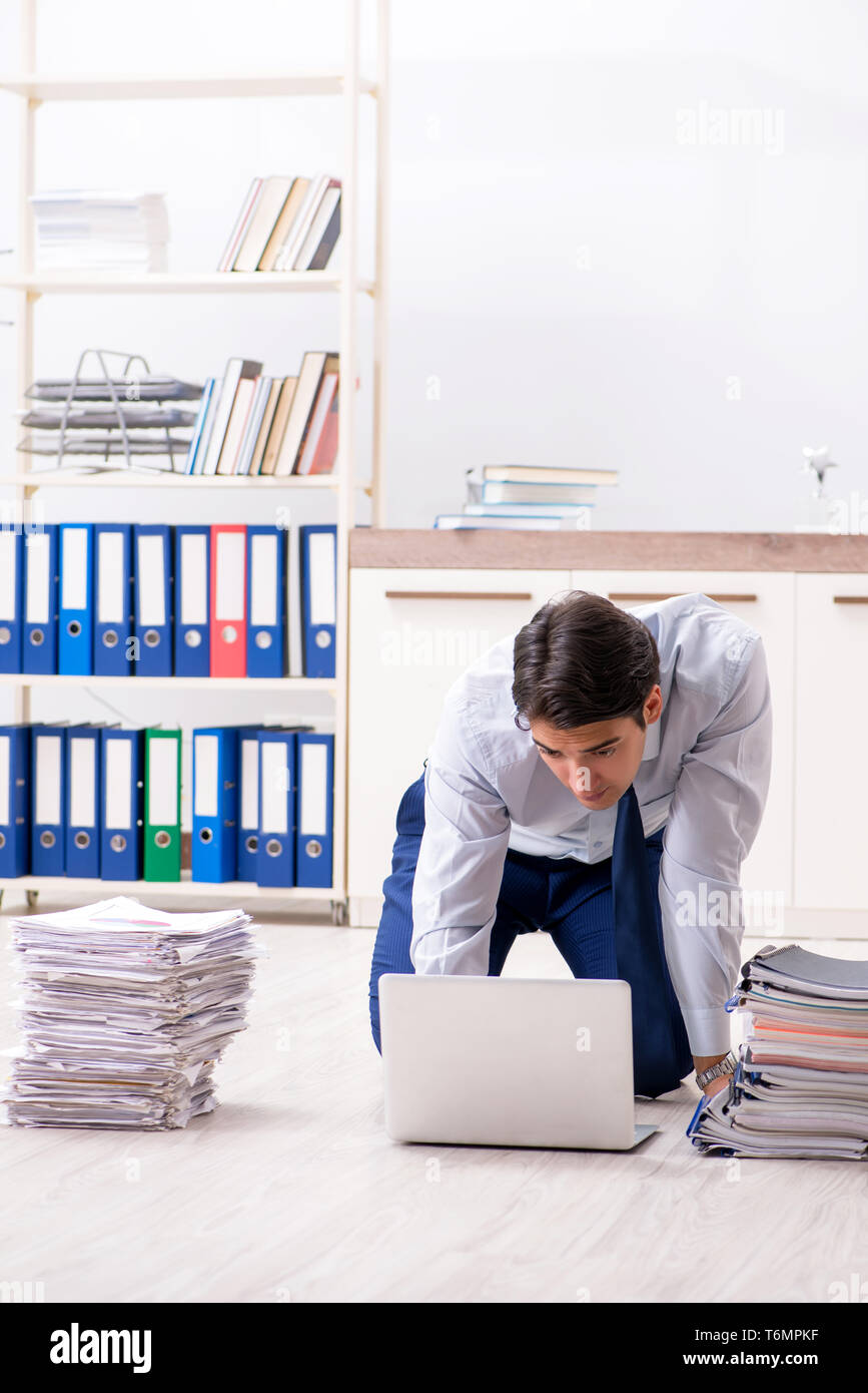 Extremely busy employee working in the office Stock Photo - Alamy