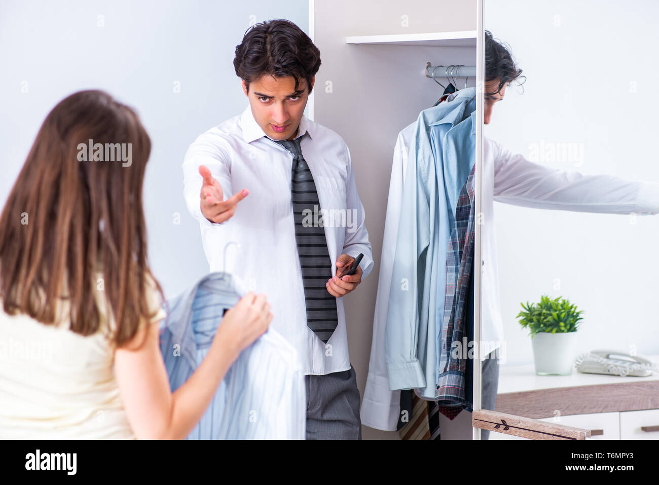 Woman sees her husband off to work Stock Photo - Alamy