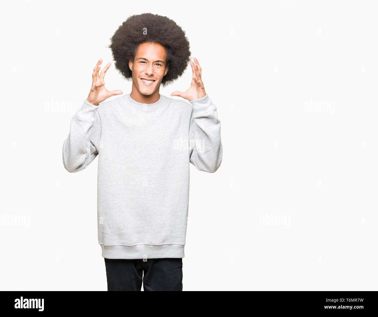 Young african american man with afro hair wearing sporty sweatshirt ...