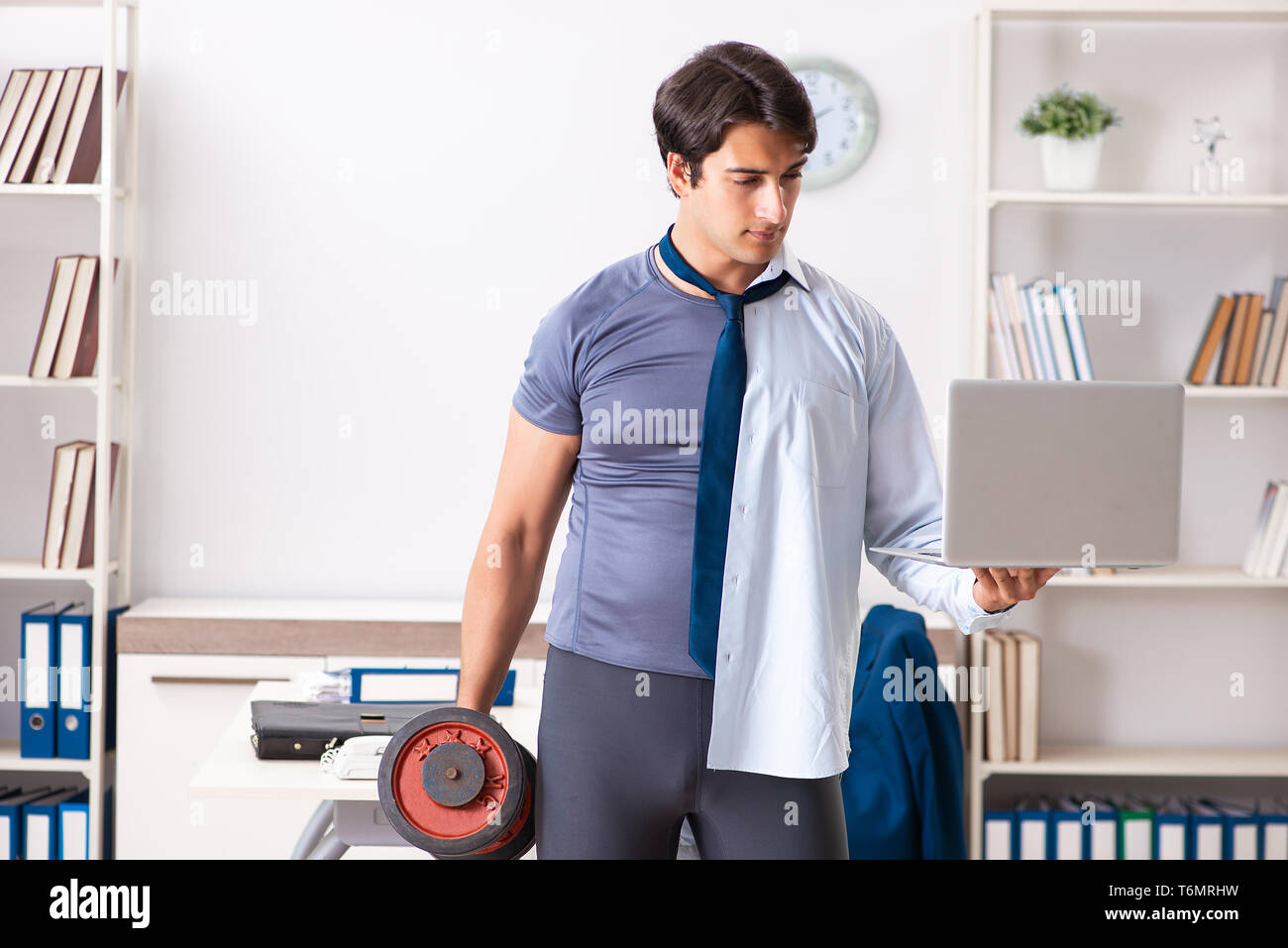 Employee combining work and healthy lifestyle Stock Photo - Alamy