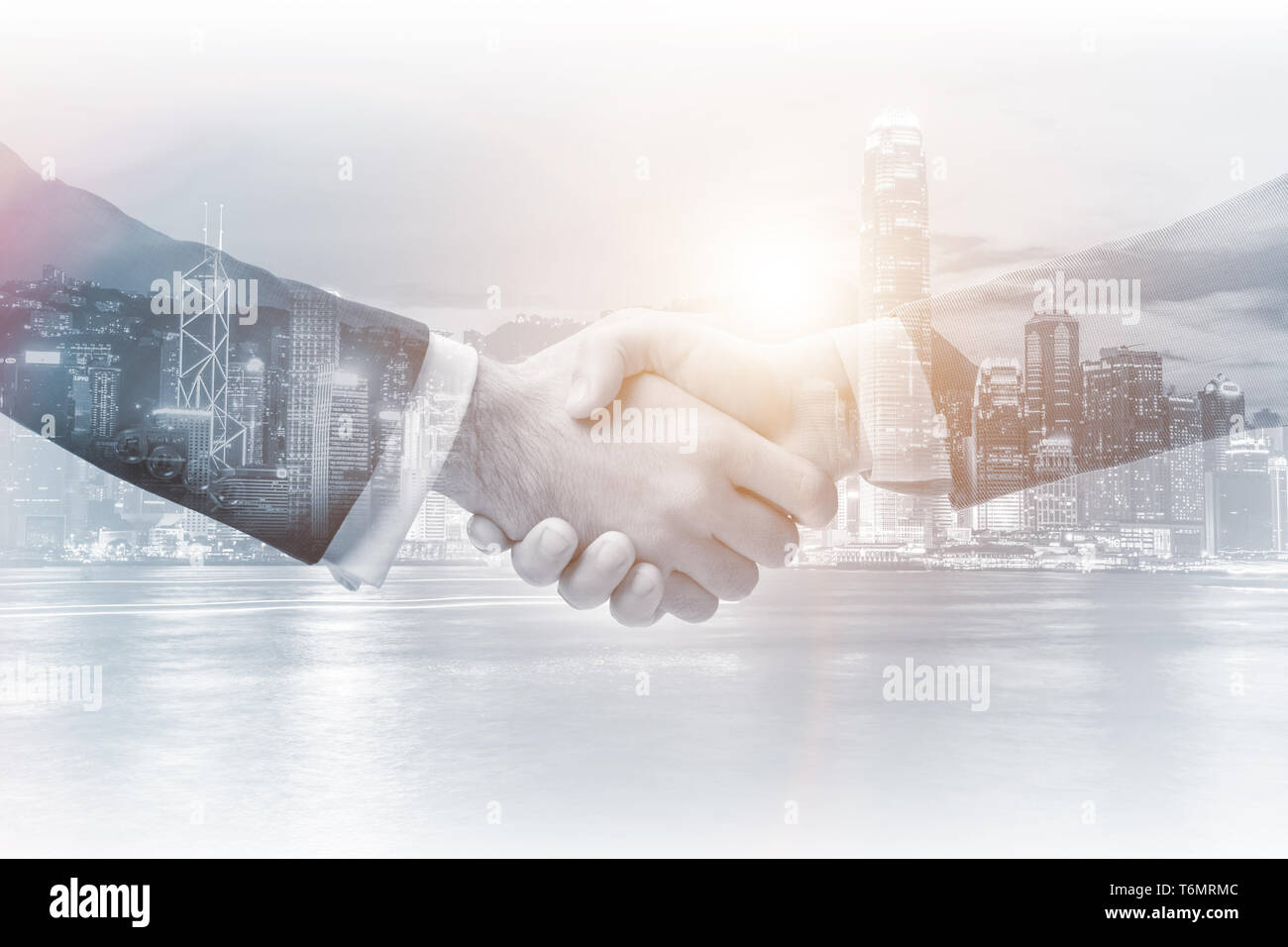 Concept of cooperation with handshake Stock Photo - Alamy