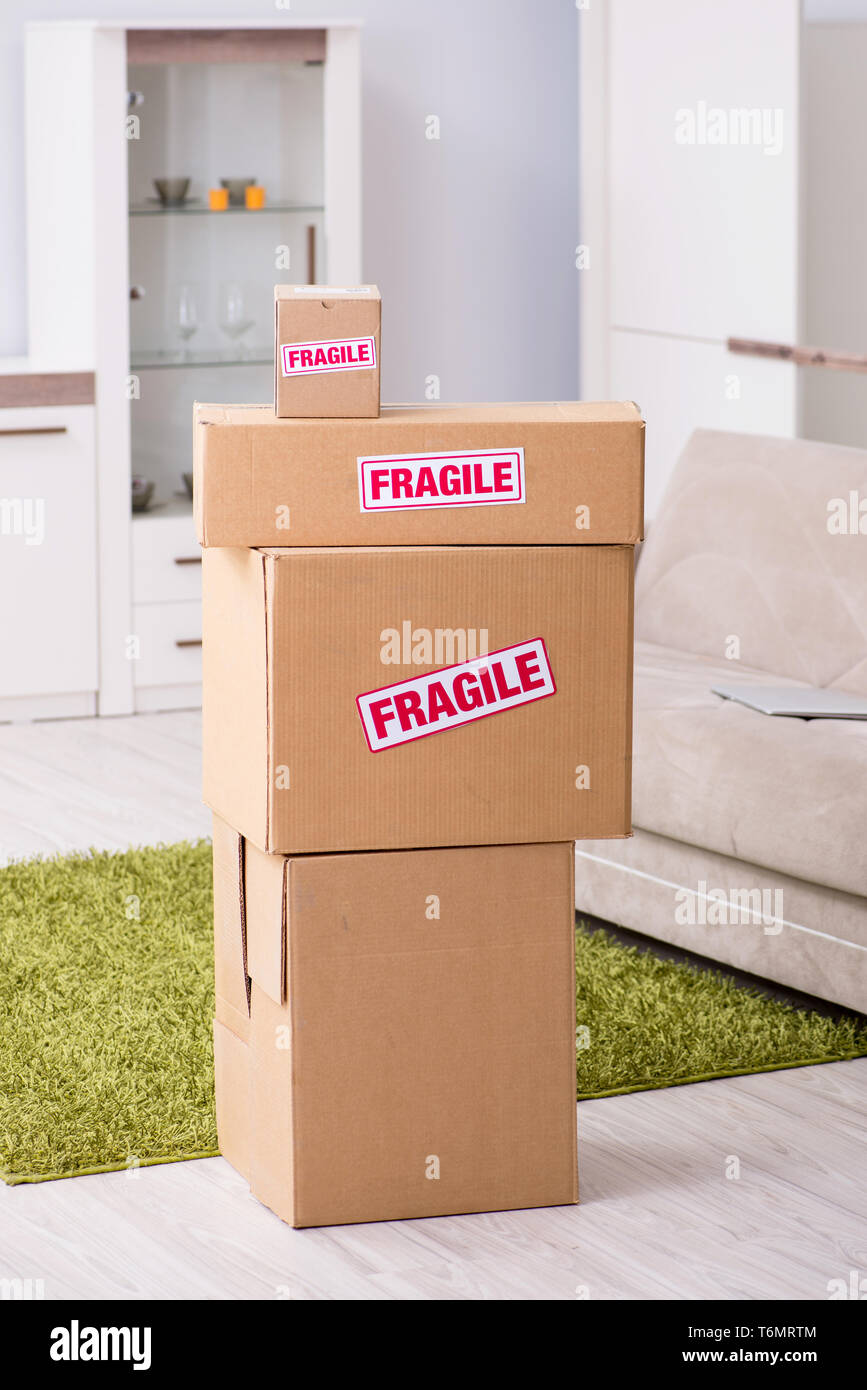 Transportation contractor with fragile boxes Stock Photo - Alamy